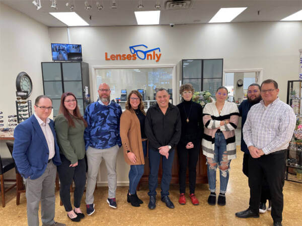 Smiling friendly staff gathered together | Lenses Only | Lenses Only